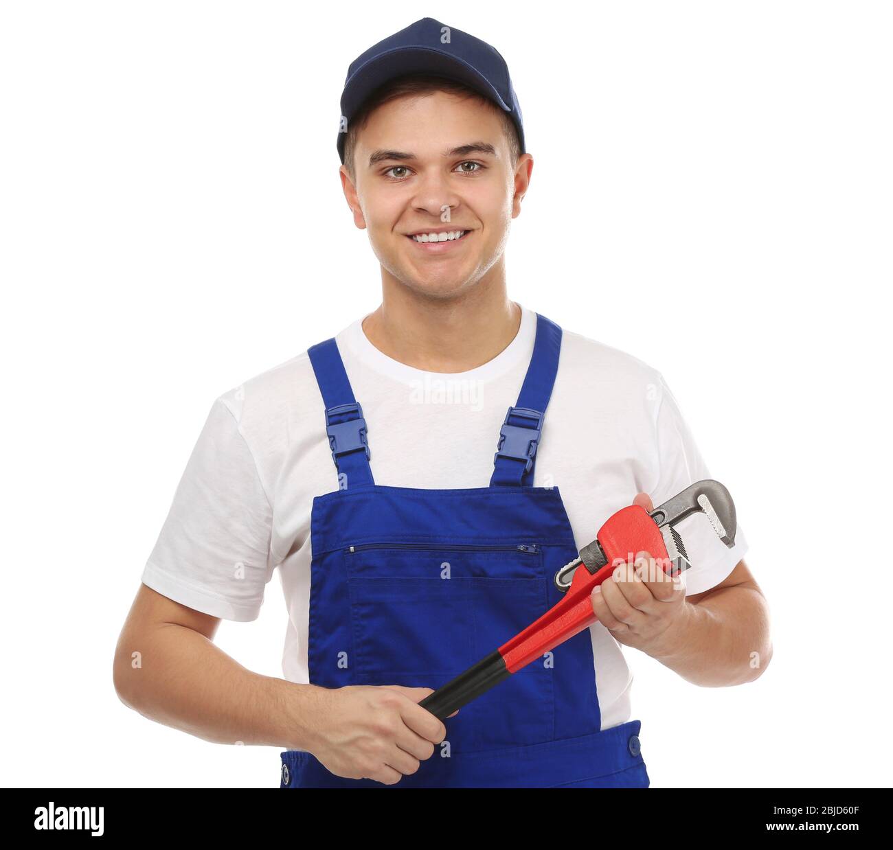 Young handsome plumber with pipe wrench on white background Stock Photo ...