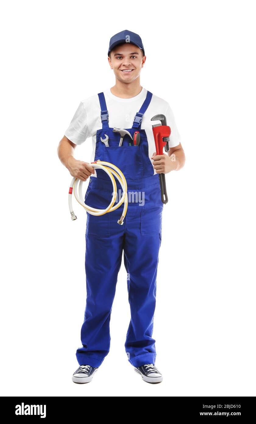 Young handsome plumber with tools on white background Stock Photo - Alamy