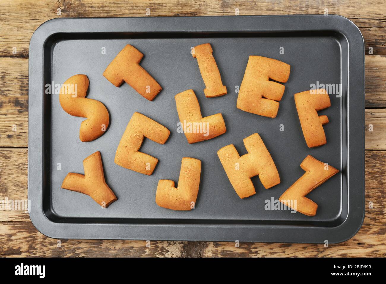 Cookie alphabet on baking tray, top view Stock Photo - Alamy