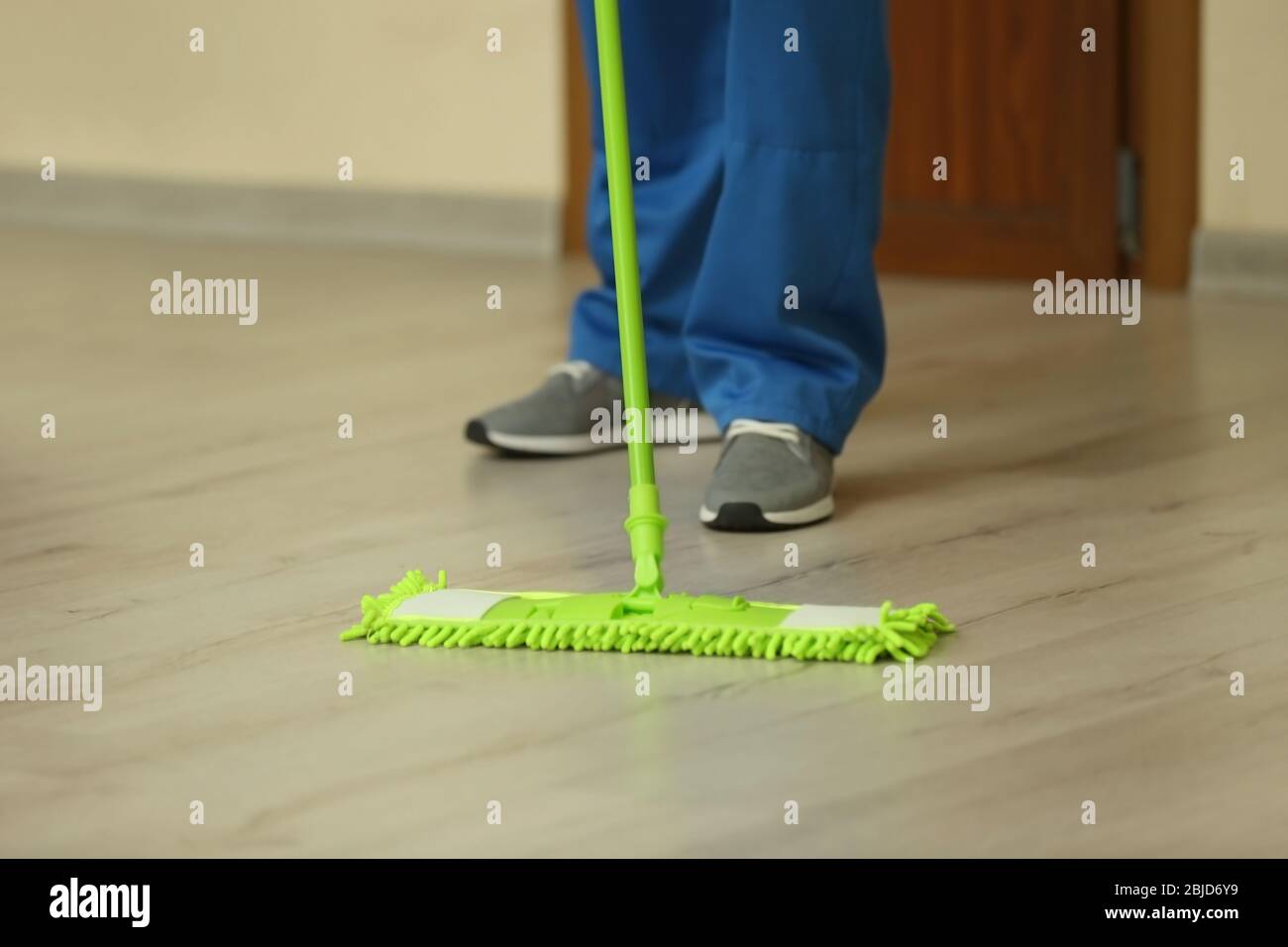 Person moping hi-res stock photography and images - Alamy