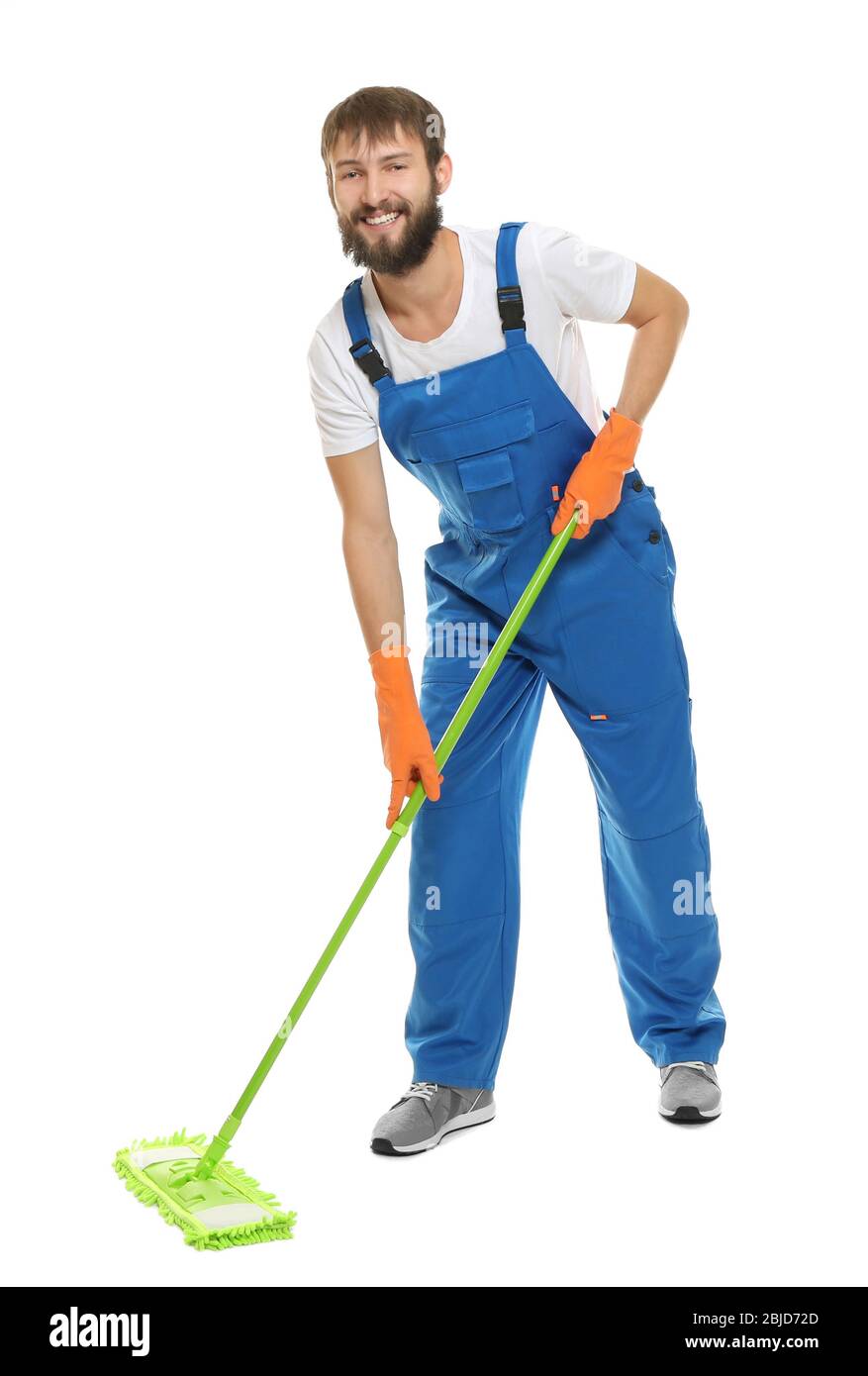 Young man moping floor, on white background Stock Photo - Alamy