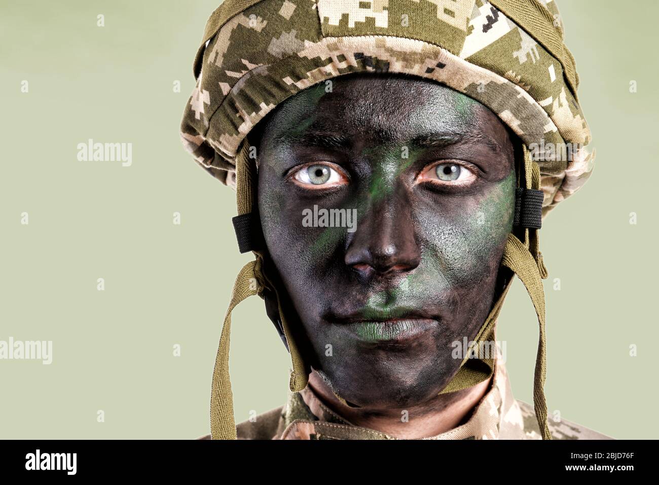 Portrait of soldier with painted face on white background Stock Photo ...
