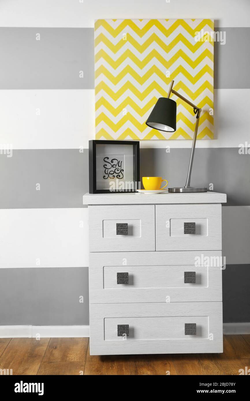 Modern interior with wooden commode Stock Photo - Alamy