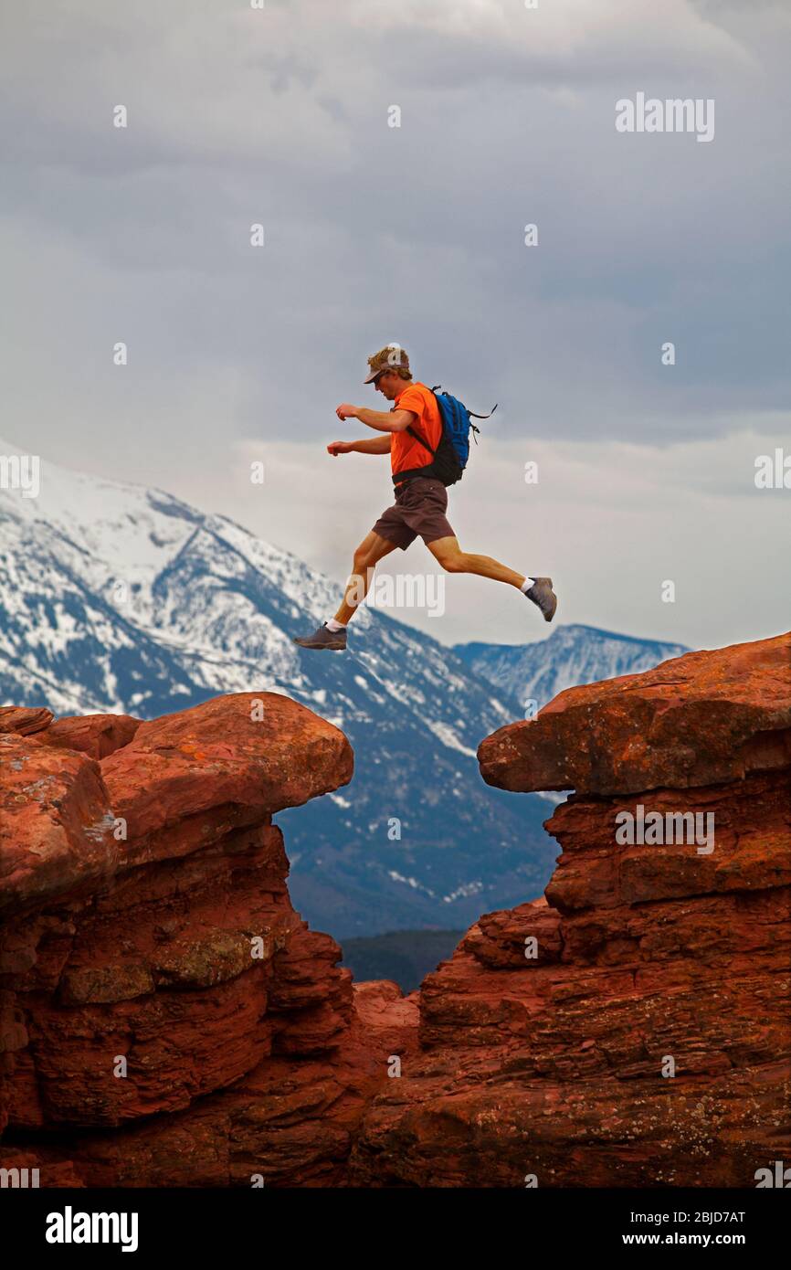 Man jumping between rocks in Carbondale / Colorado Stock Photo - Alamy
