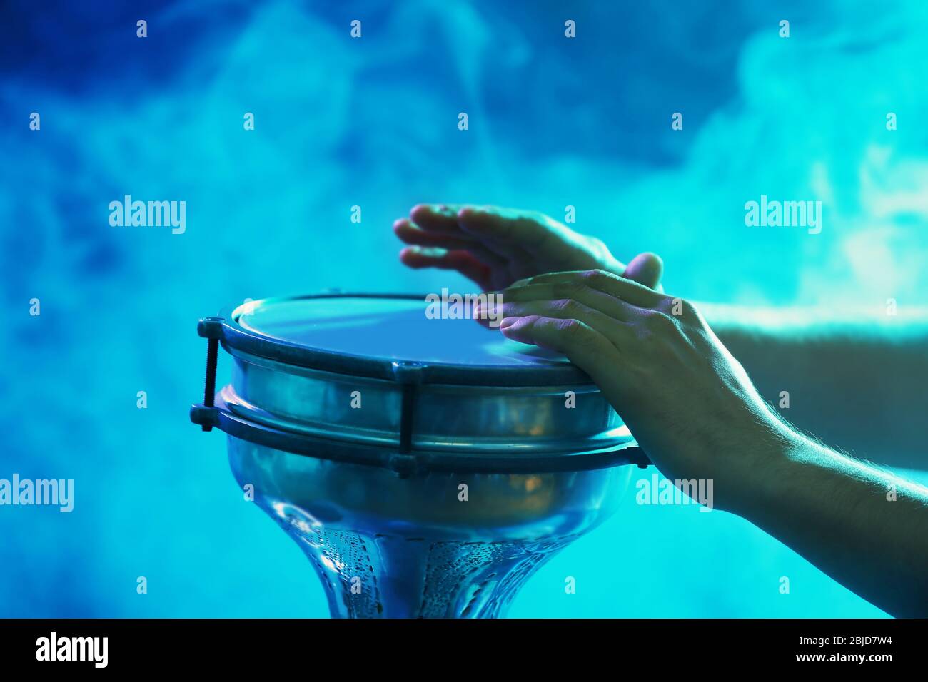 Hands of man playing African drum at concert Stock Photo - Alamy