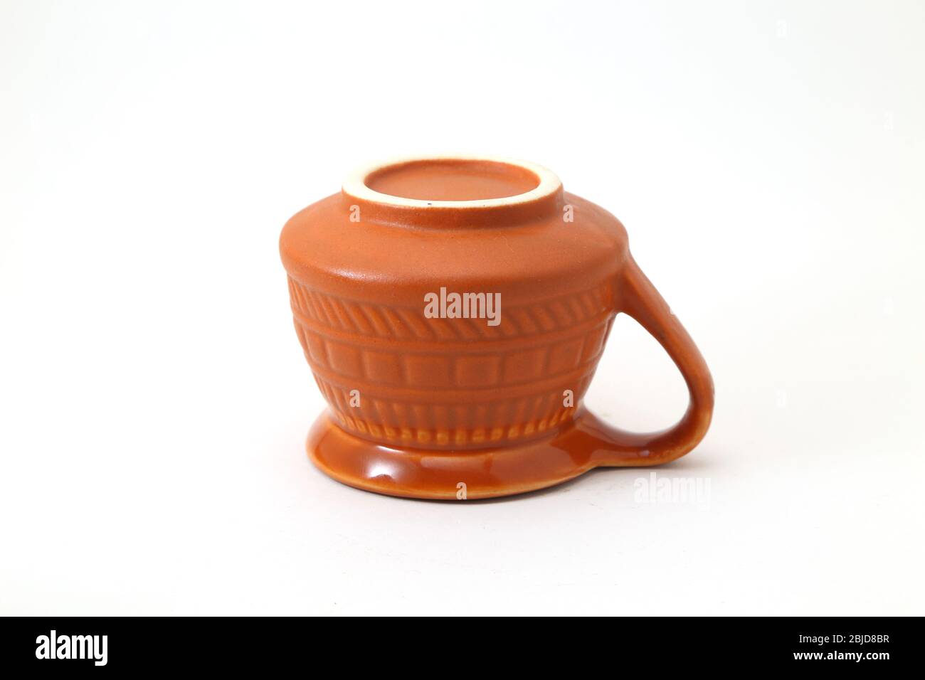 Brown color ceramic cup or crockery Stock Photo - Alamy