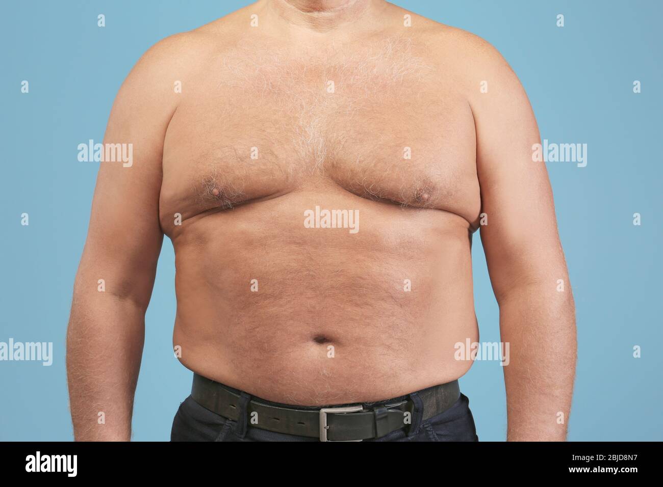 Senior man body on grey background Stock Photo - Alamy