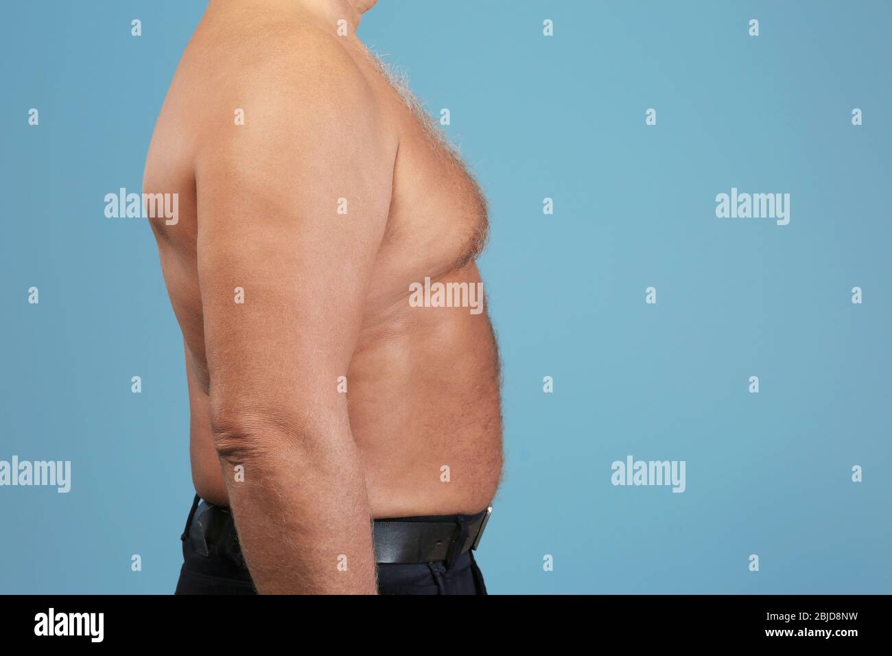 Senior man body on grey background Stock Photo - Alamy