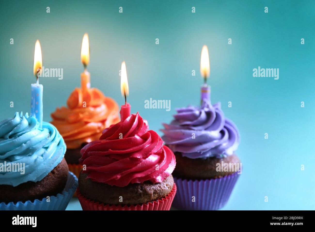 Birthday cupcakes with candles hi-res stock photography and images - Alamy