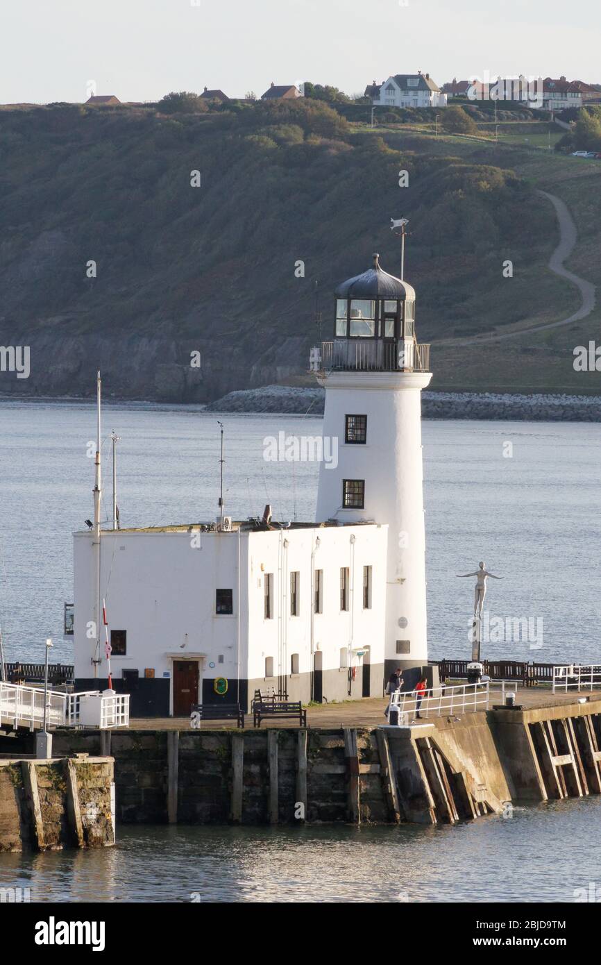 Scarborough lighthouse in the evening sun. Yorkshire England UK Stock ...