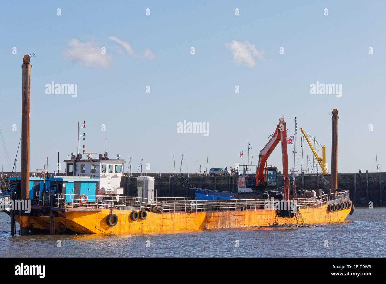 The 'Sandsend' dredger working in Scarborough harbour Stock Photo - Alamy