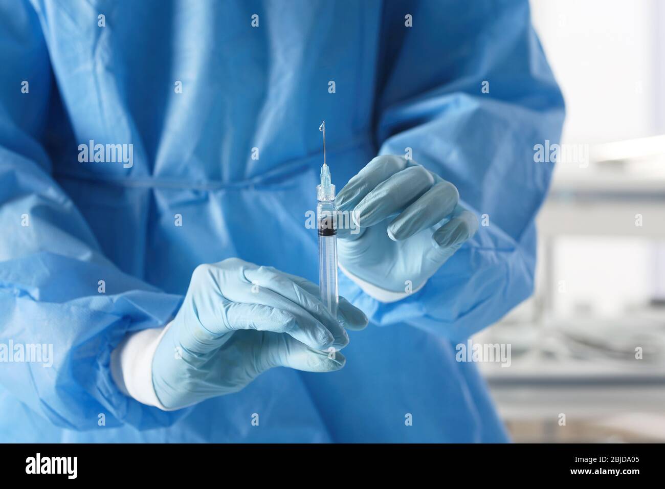 Doctor holding prepared injection hi-res stock photography and images ...