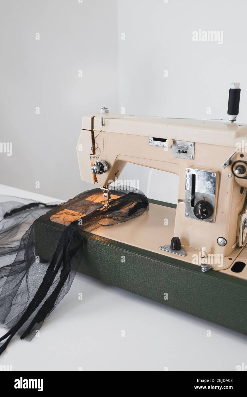 Sewing process f dress from black textile mesh fatinon the sewing ...