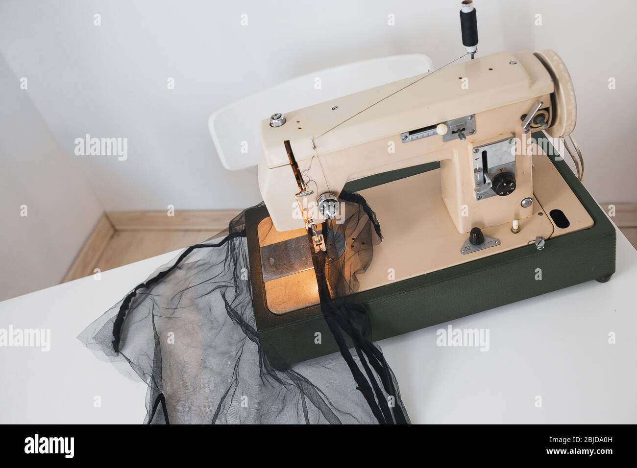 Sewing process f dress from black textile mesh fatinon the sewing ...