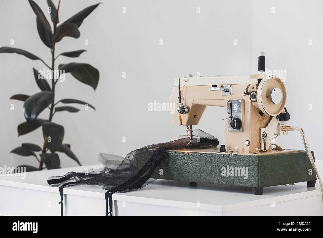 Sewing process f dress from black textile mesh fatinon the sewing ...