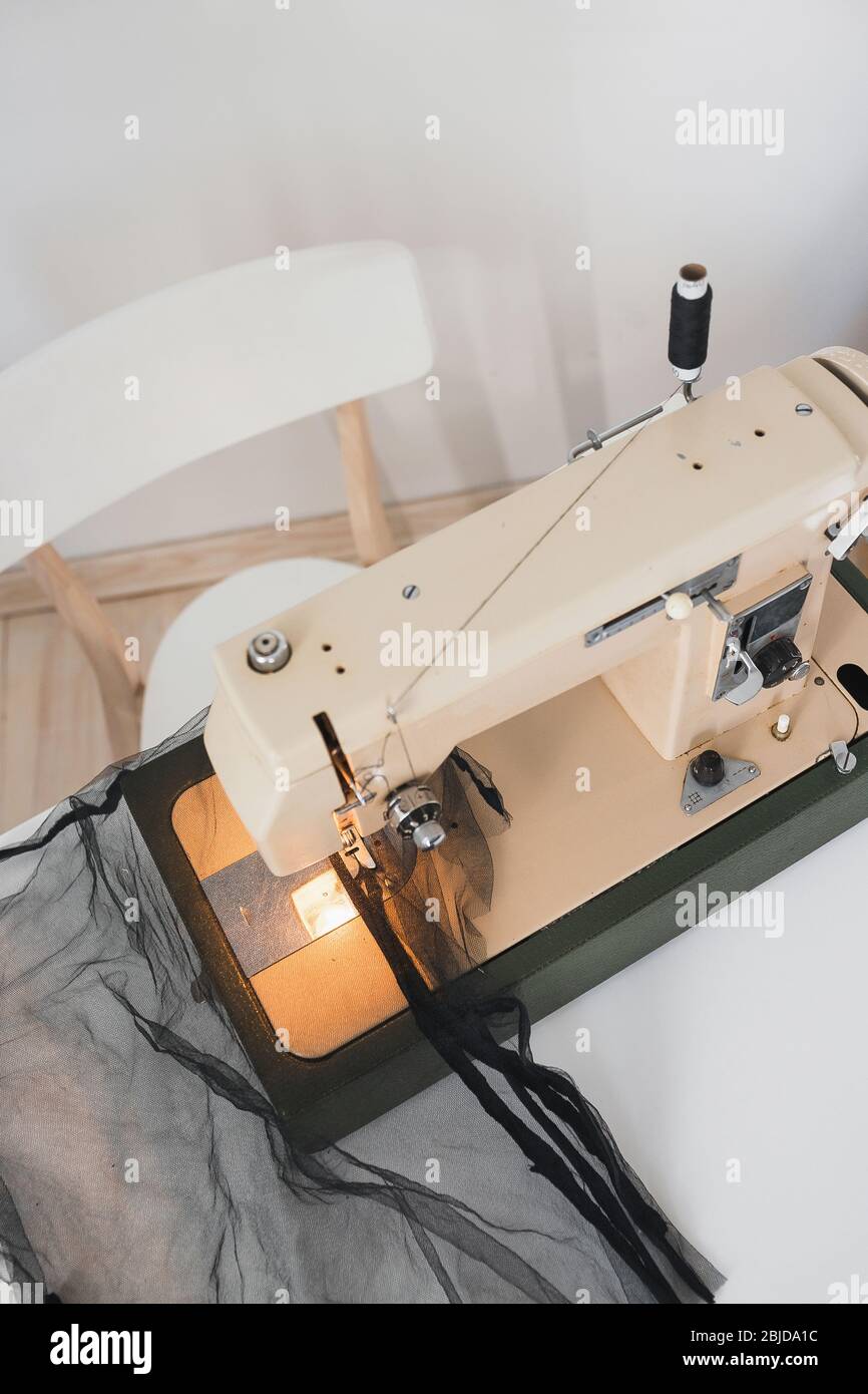 Sewing process f dress from black textile mesh fatinon the sewing ...