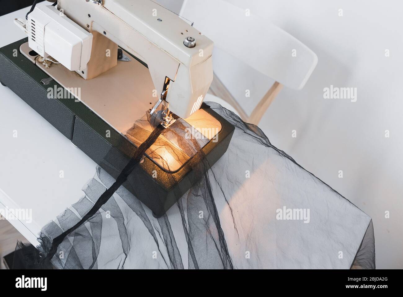 Sewing process f dress from black textile mesh fatinon the sewing ...