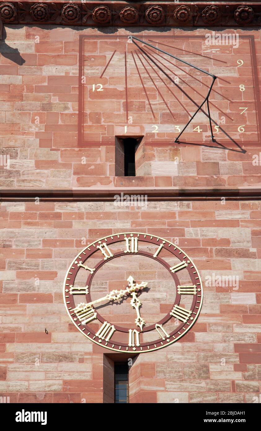 two clocks sun clock and tower clock Stock Photo - Alamy