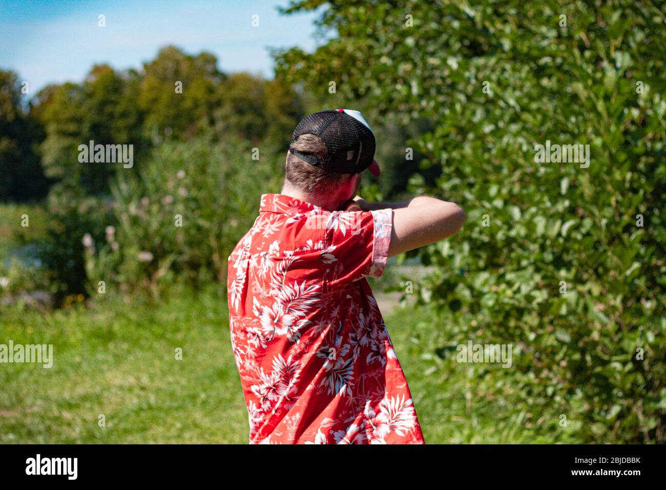Young man aiming with a wind rifle in the clearing Stock Photo - Alamy