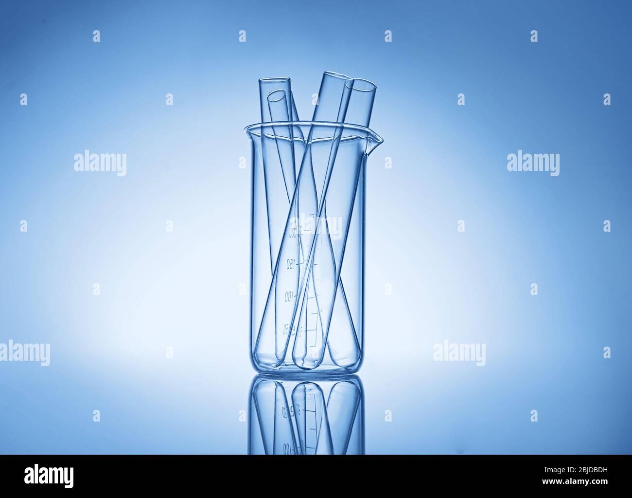 Test tubes on colour background Stock Photo - Alamy