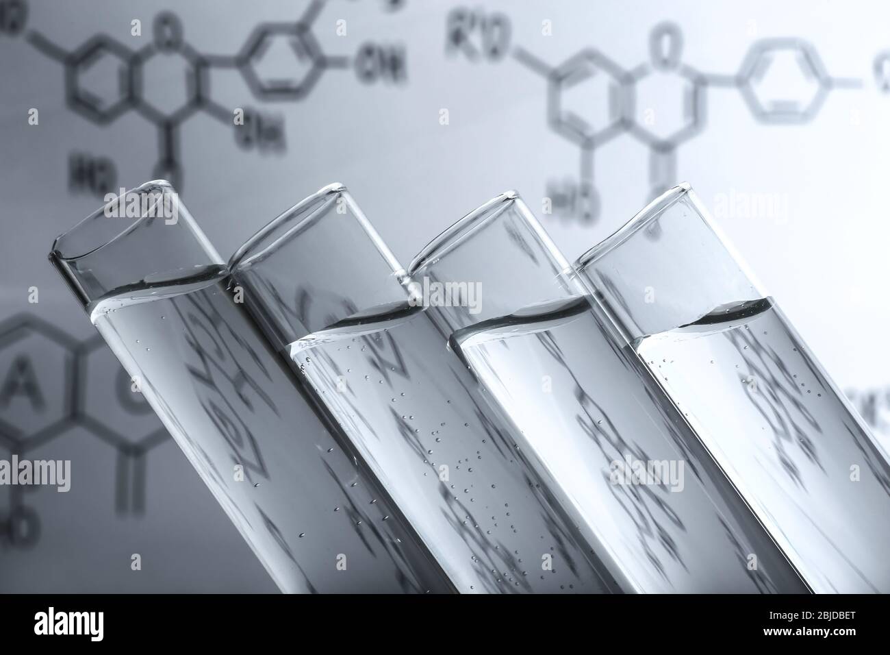 Test tubes on colour background Stock Photo - Alamy
