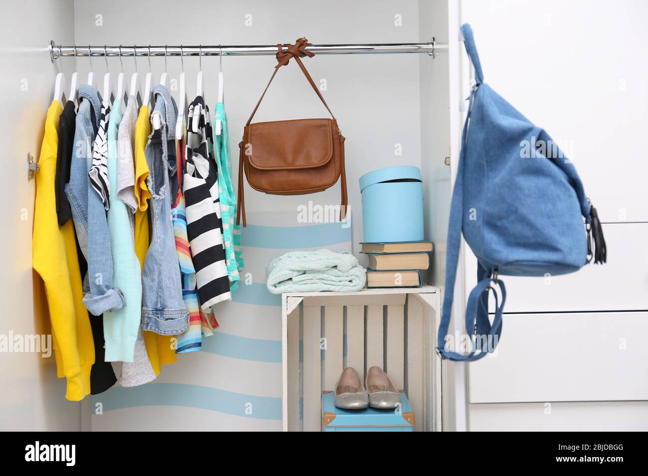 Collection of clothes hanging on a rack Stock Photo - Alamy