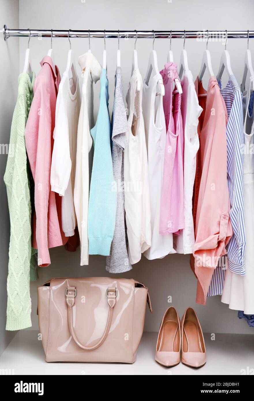 Collection of clothes hanging on a rack Stock Photo - Alamy