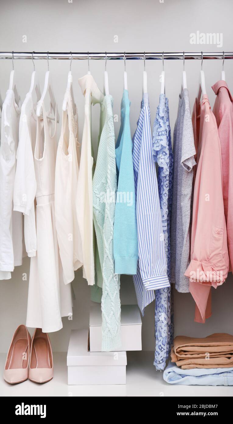 Collection of clothes hanging on a rack Stock Photo - Alamy