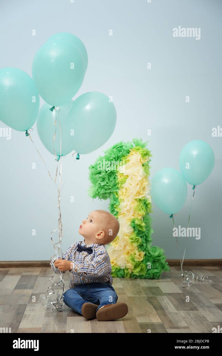 Cute baby boy with birthday decor Stock Photo - Alamy