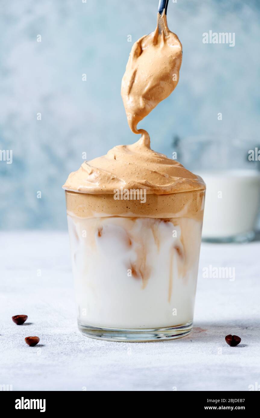 Iced Dalgona Coffee with Spoon on Ligrht Background. Trendy Creamy ...