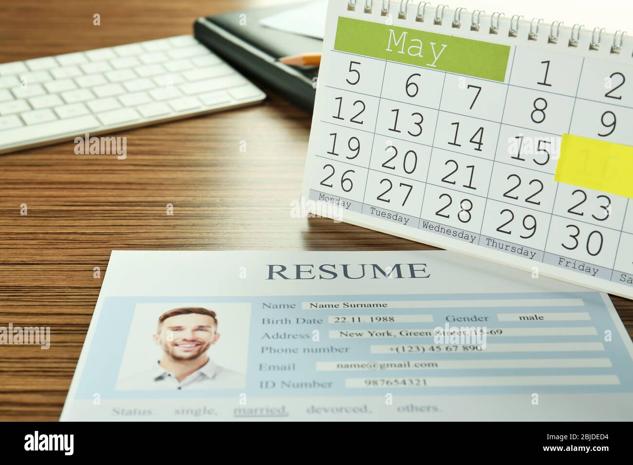 Calendar with job interview reminder and resume on wooden table Stock ...