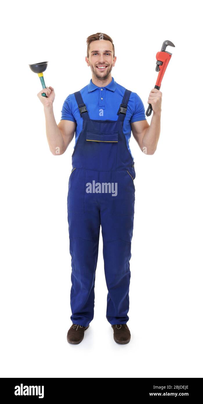 Plumber in blue uniform holding screw-wrench and plunger on white ...