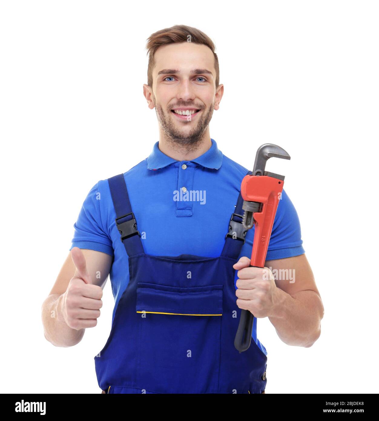 Smiling plumber holding screw-wrench on white background Stock Photo ...