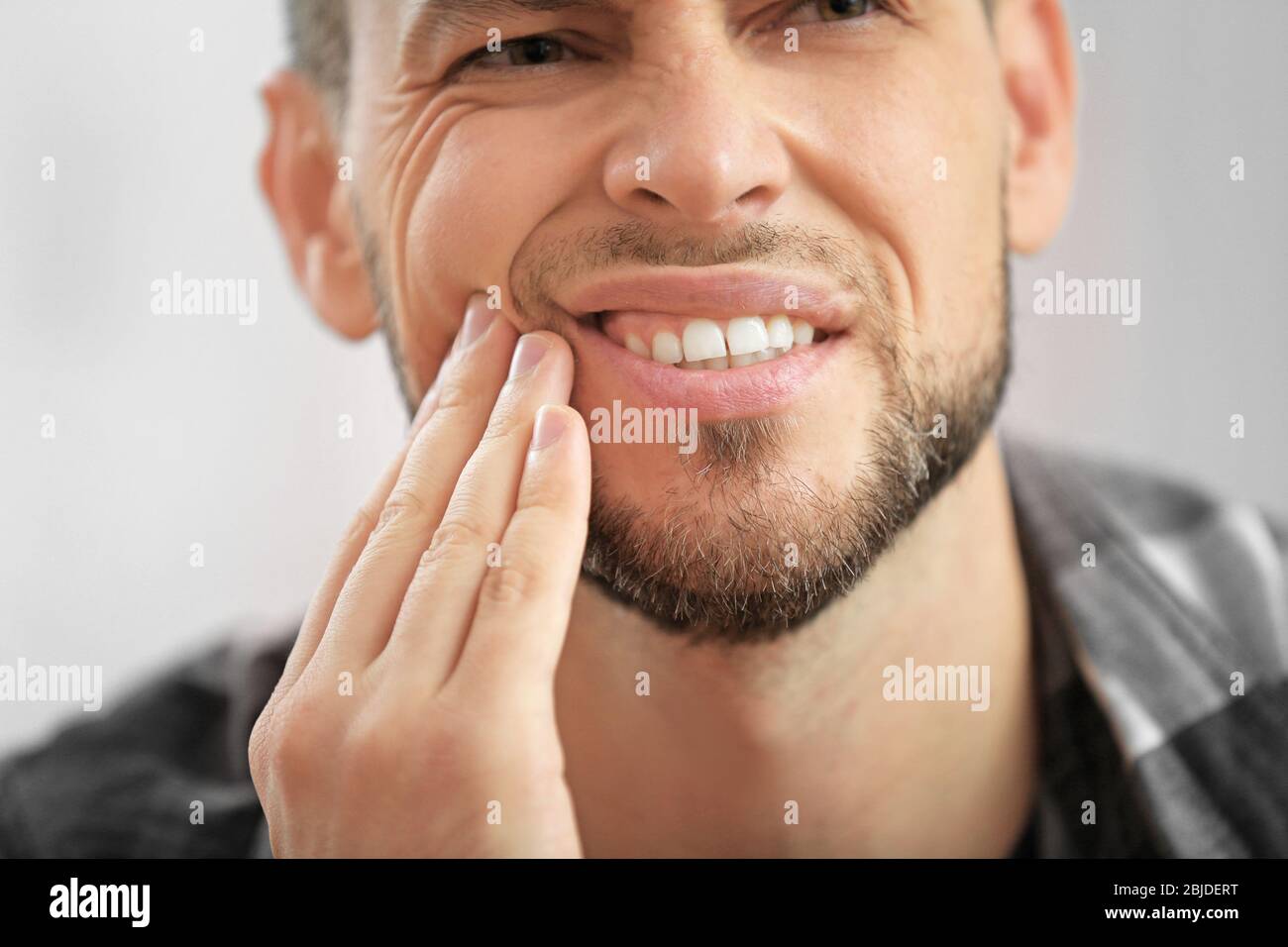 Toothache handsome young man tooth hi-res stock photography and images ...
