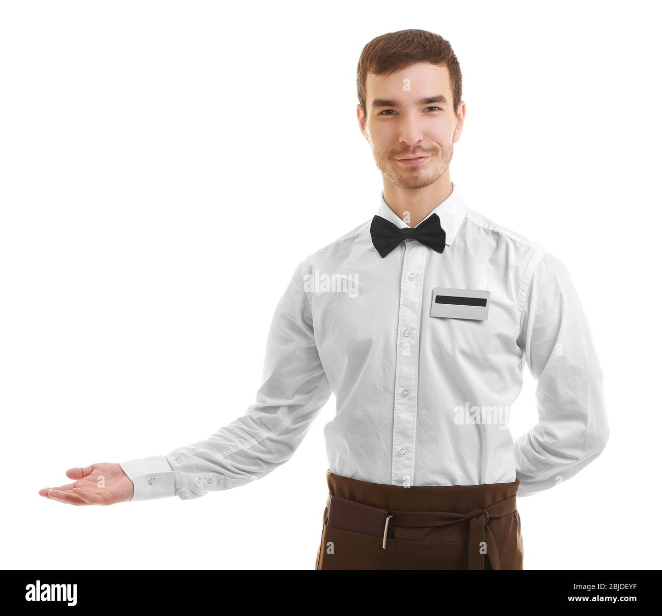 Cute waiter welcoming you on white background Stock Photo - Alamy