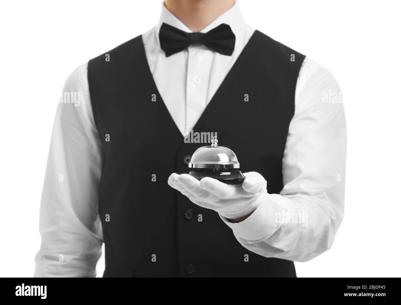 Bellboy holding bell on his hand, close up Stock Photo - Alamy