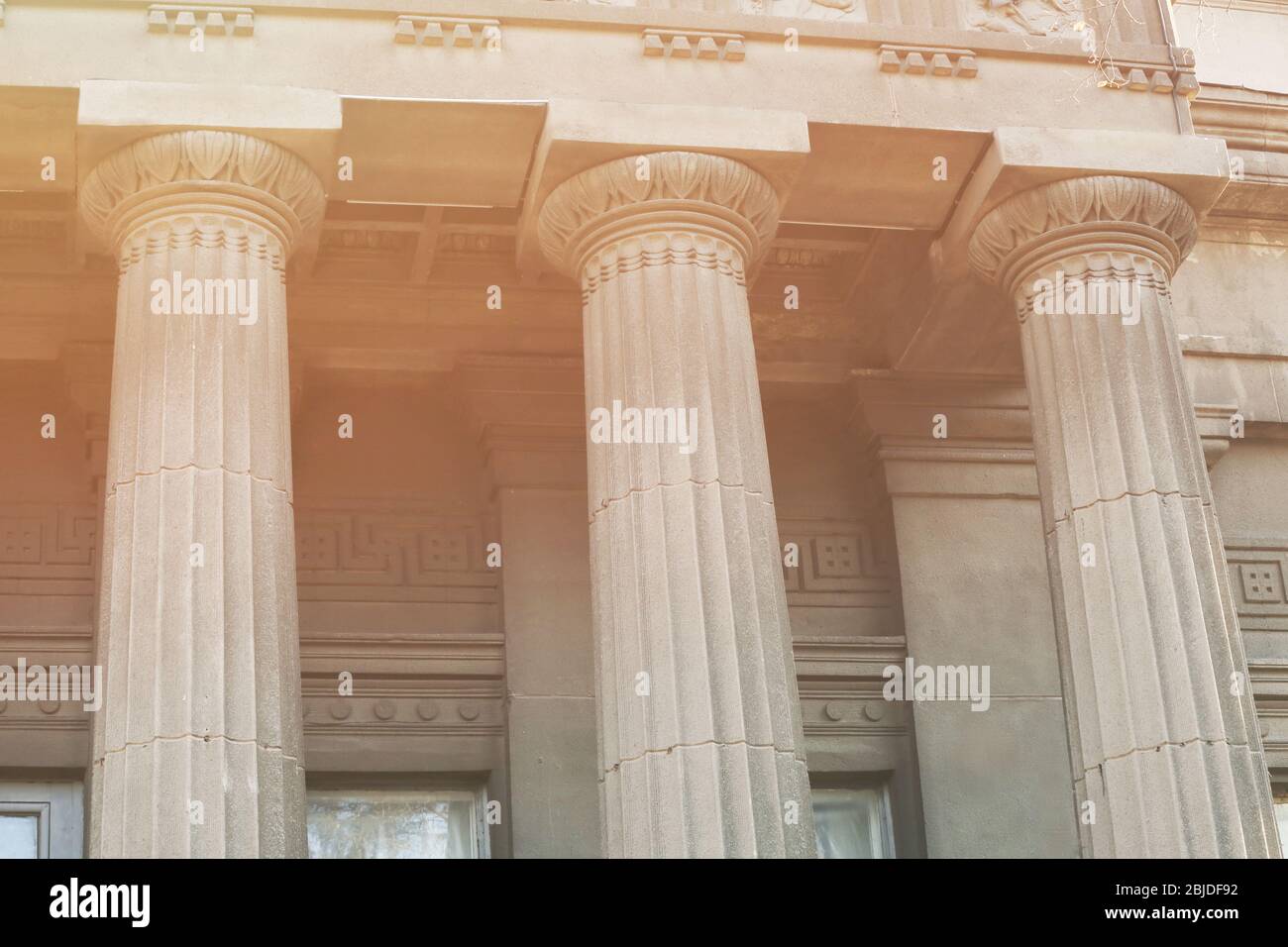 Closeup of building with columns in neoclassical style Stock Photo - Alamy