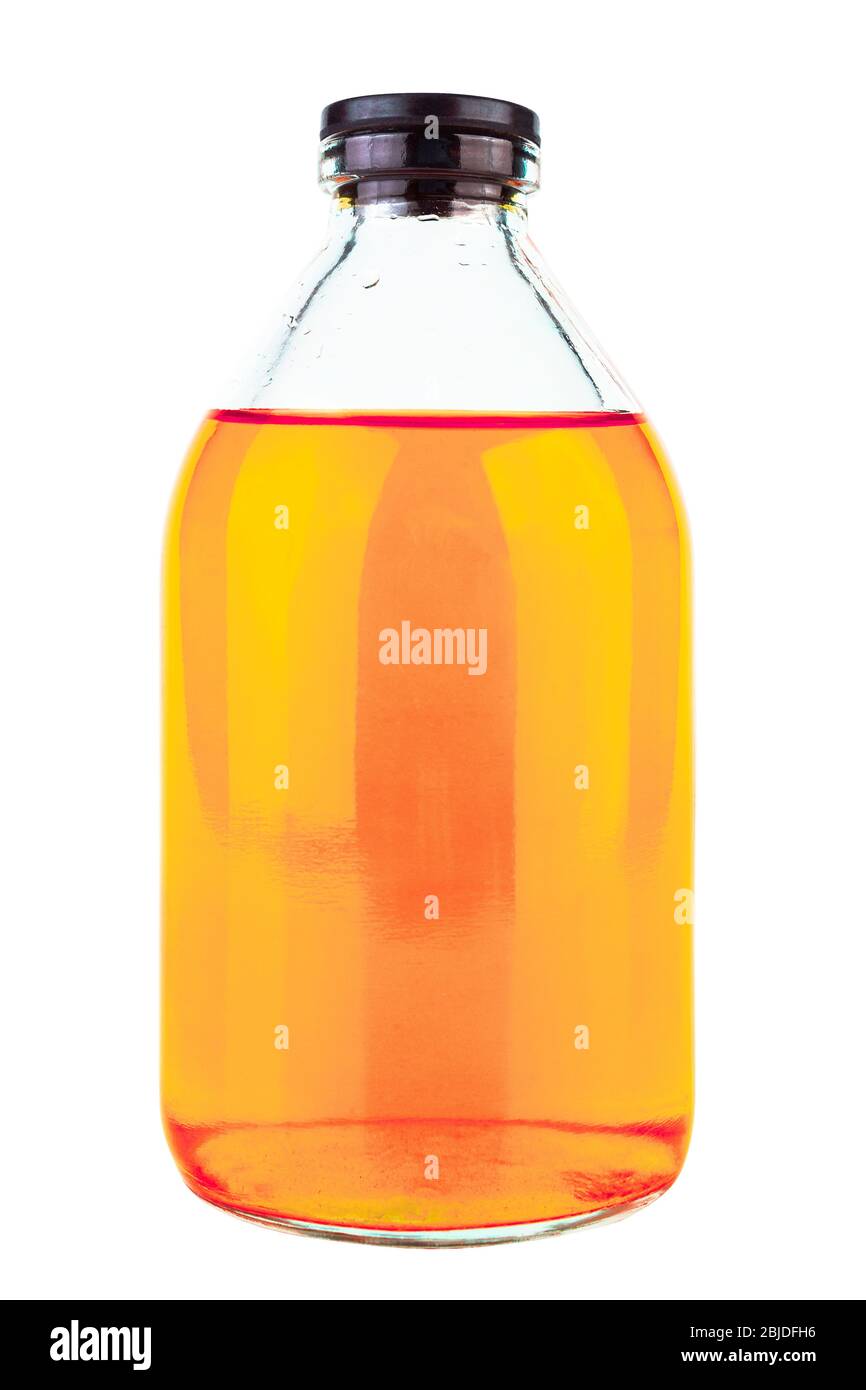 closed old style glass medical or chemical bottle with yellow ...