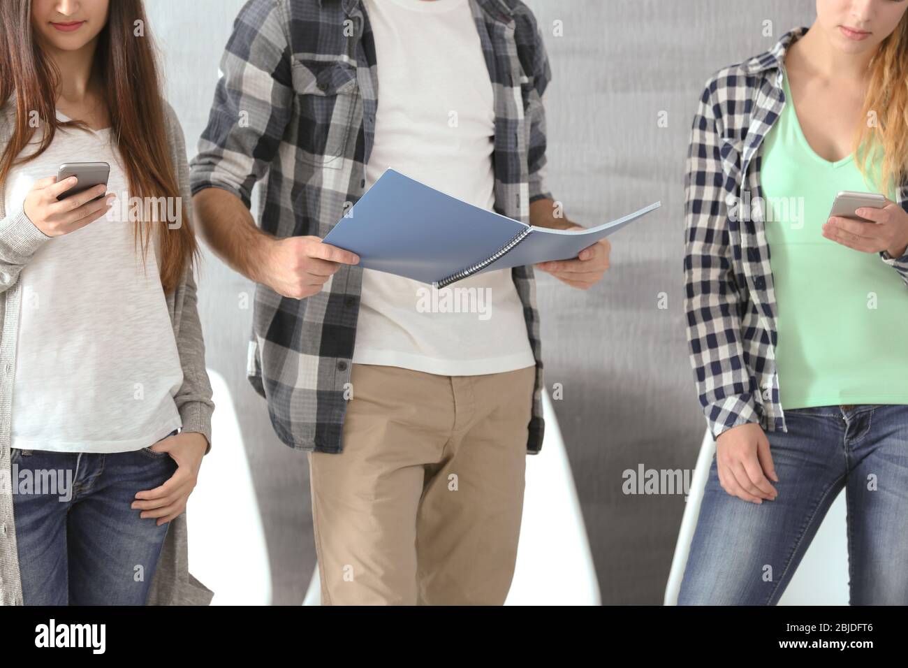 Group of young people waiting for interview indoors Stock Photo - Alamy