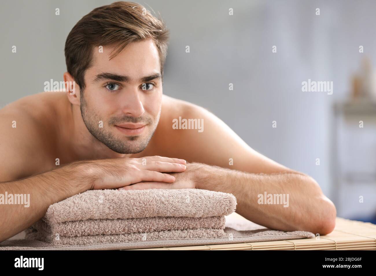 Man relaxing in spa salon Stock Photo - Alamy