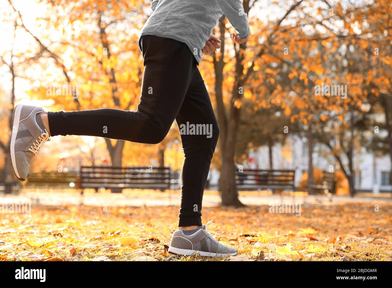 Man running in autumn park hi-res stock photography and images - Alamy