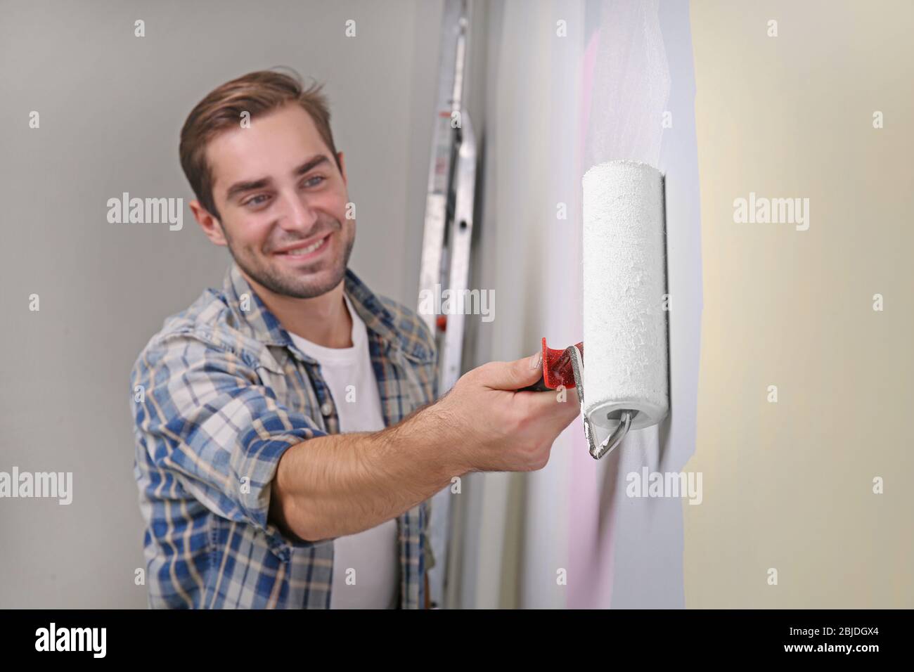Handsome young man painting hi-res stock photography and images - Alamy