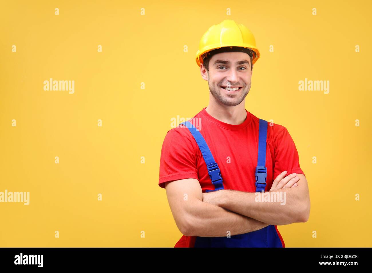 Young handsome construction worker works hi-res stock photography and ...