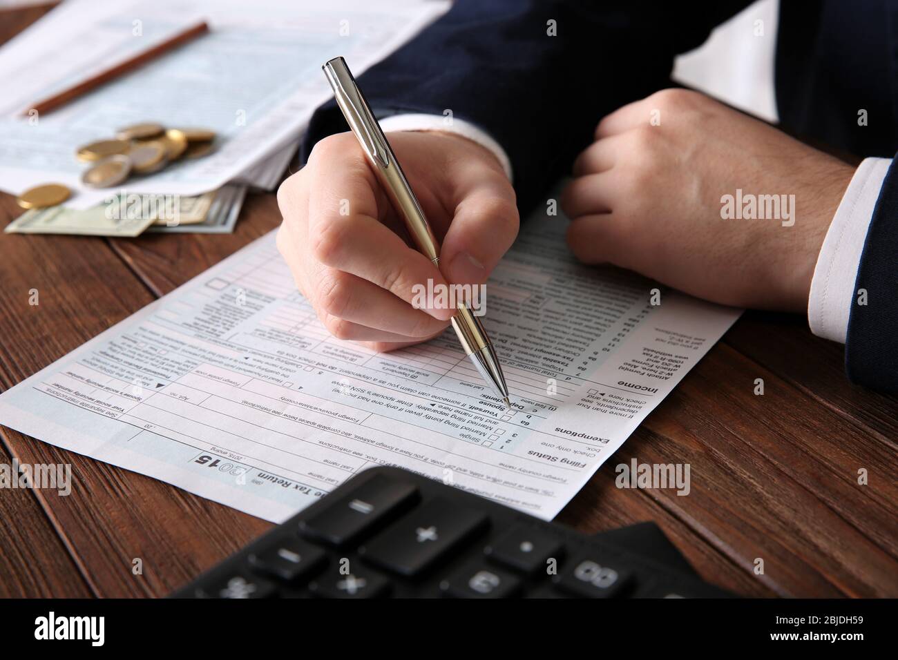 Man sitting table paper bills hi-res stock photography and images - Alamy