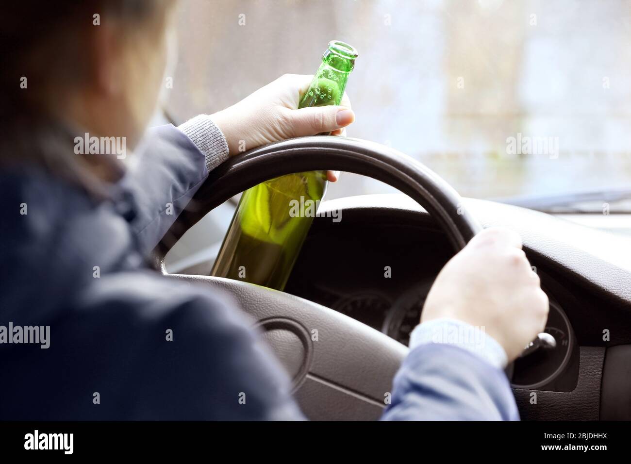 Drunk woman driving car beer hi-res stock photography and images - Alamy