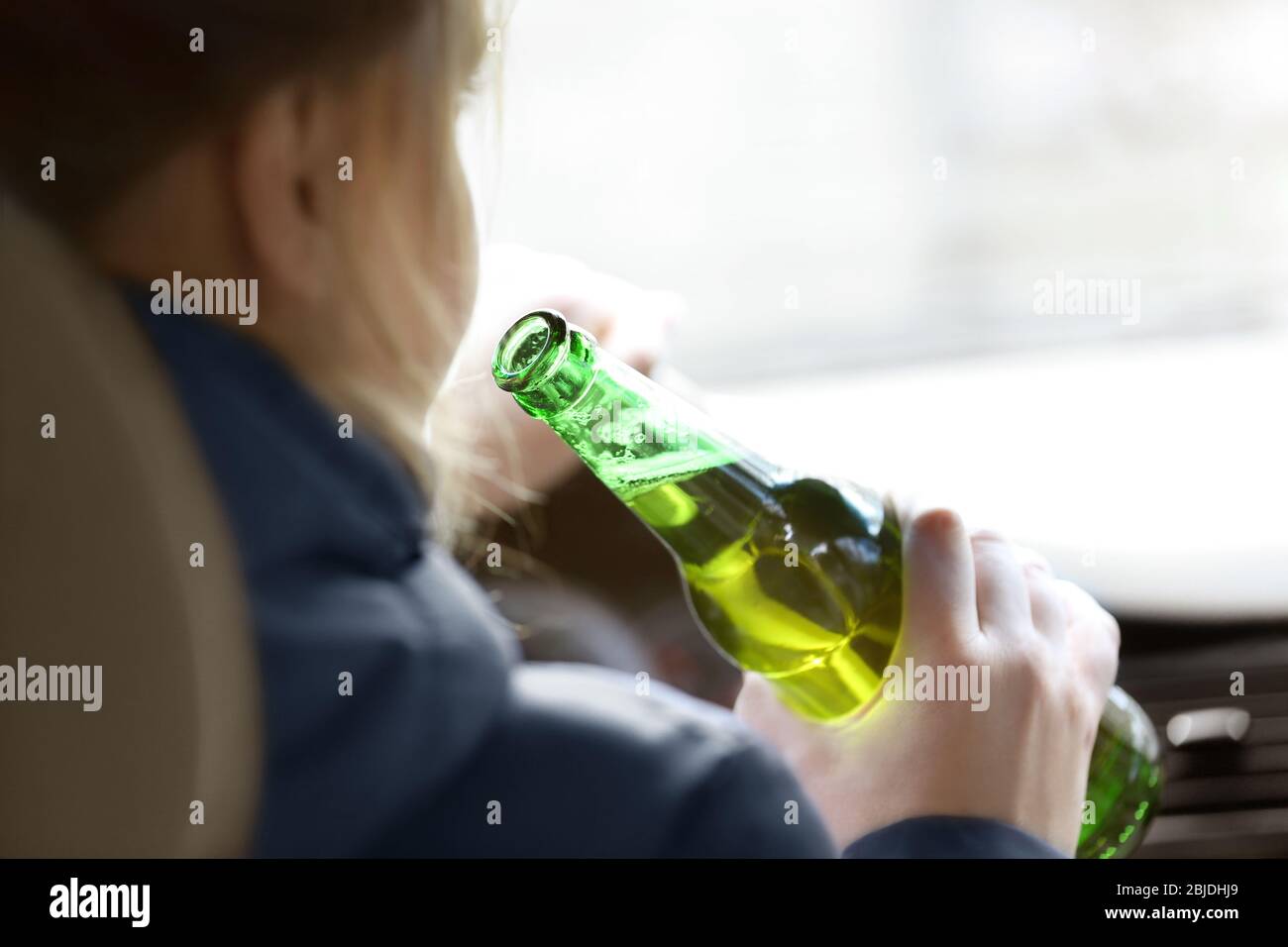 Drunk woman driving car beer hi-res stock photography and images - Alamy