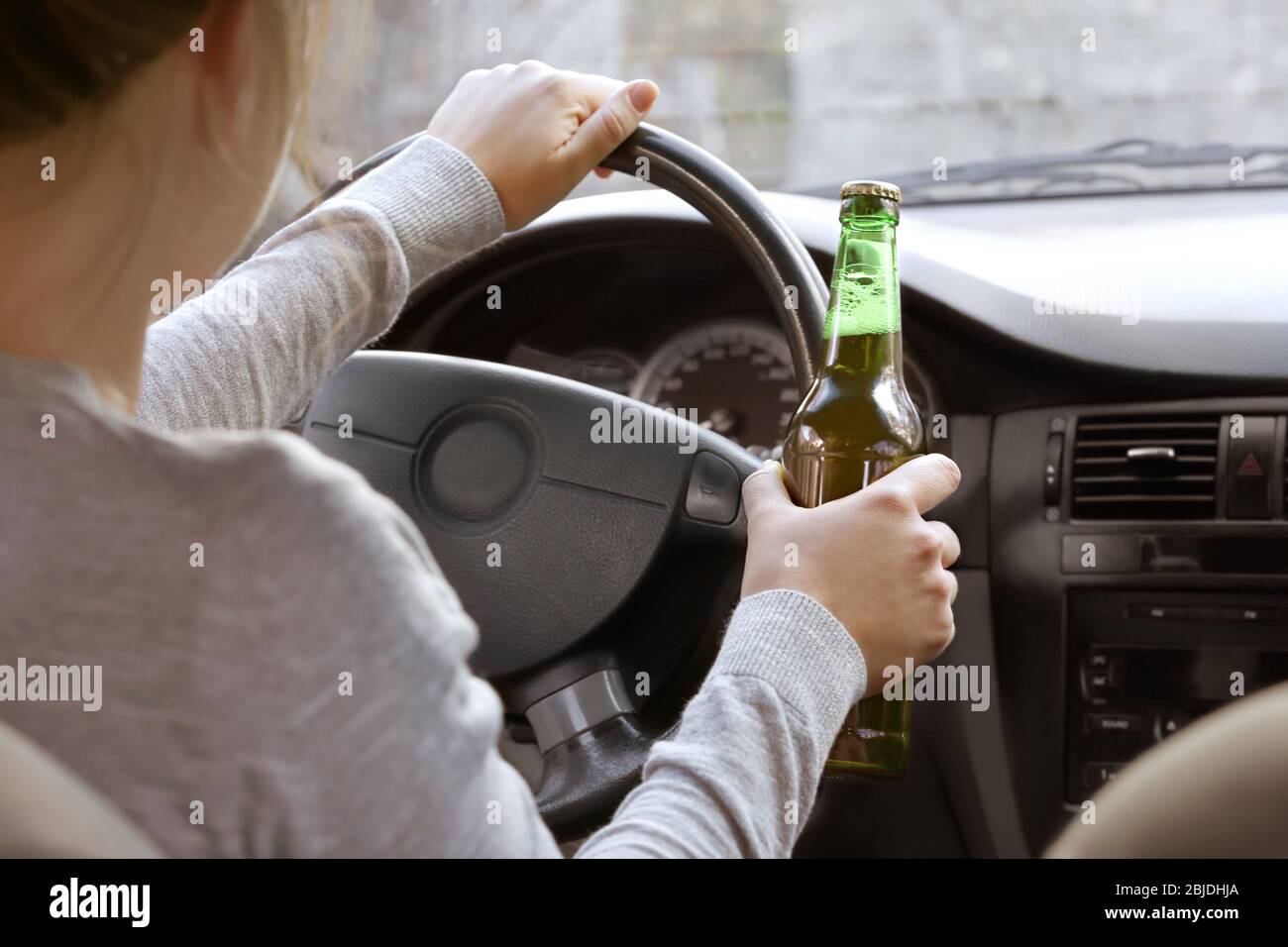 Drunk woman driving car beer hi-res stock photography and images - Alamy