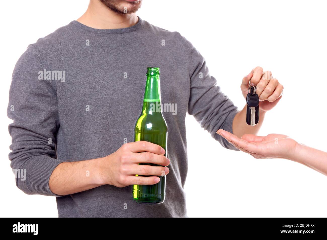 Close up view of drunk man giving car key to woman, on white background ...