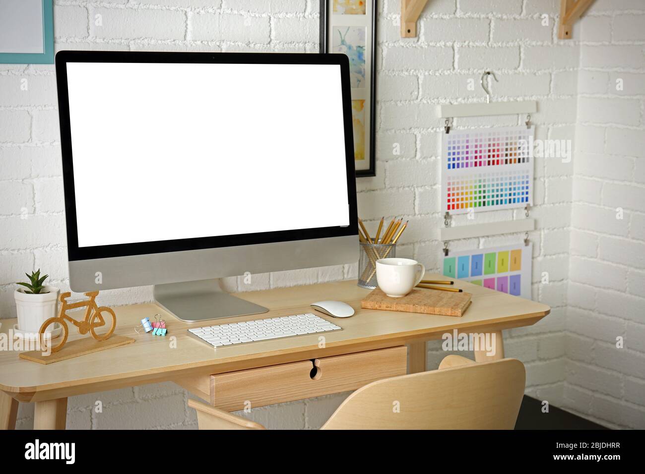 Workplace with computer on table in modern room Stock Photo - Alamy