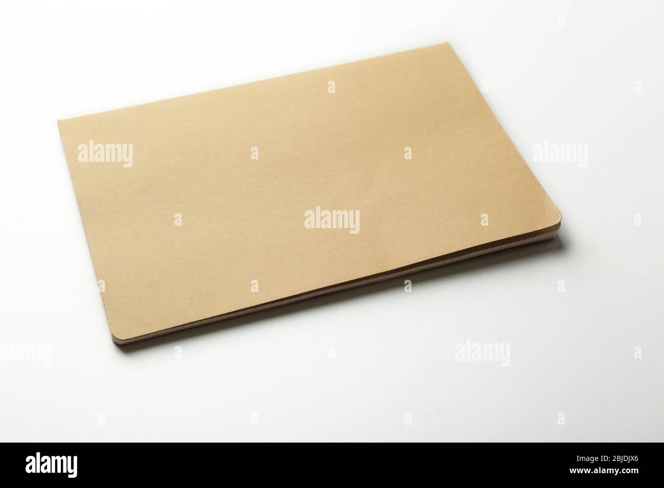 Blank beige notebook on white background Stock Photo - Alamy